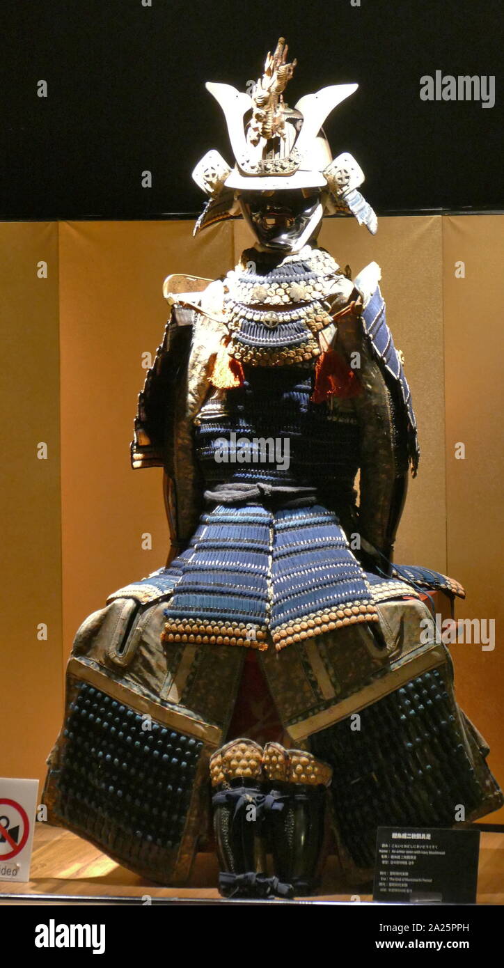 16th century Japanese samurai armour. Showing helmet and full tunic ...