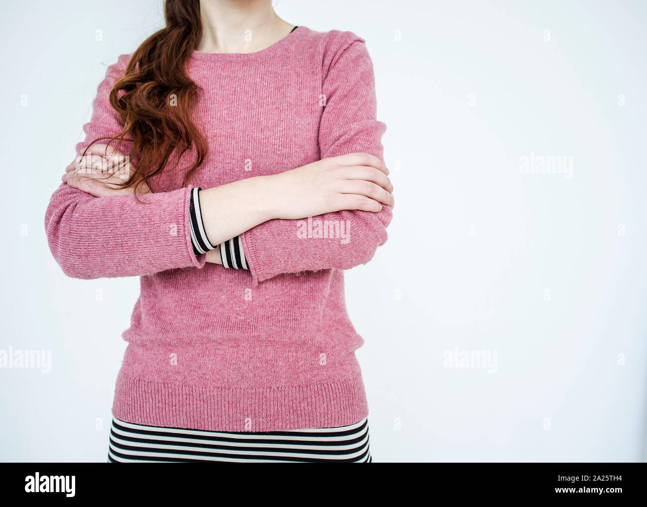 Slim young girl standing arms crossed on white background Stock Photo ...