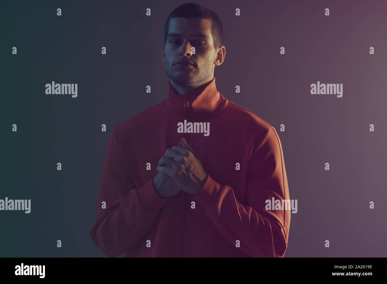 Close-up portrait of attractive male model. Retro wave portrait of a ...