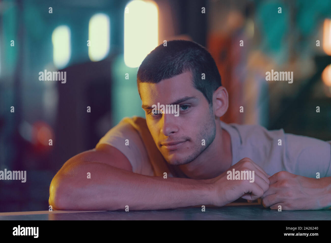 Close-up portrait of attractive male model. Retro wave portrait of a ...