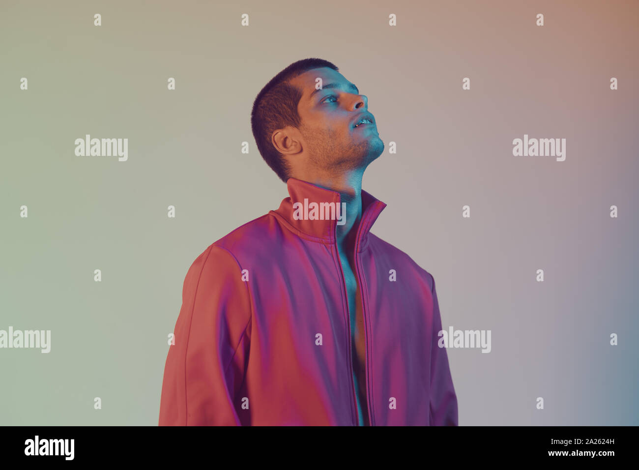 Close-up portrait of attractive male model. Retro wave portrait of a ...