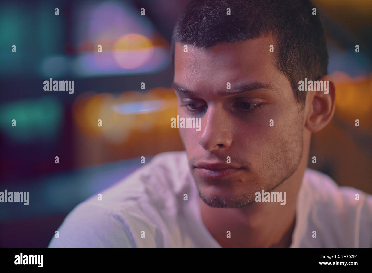 Close-up portrait of attractive male model. Retro wave portrait of a ...