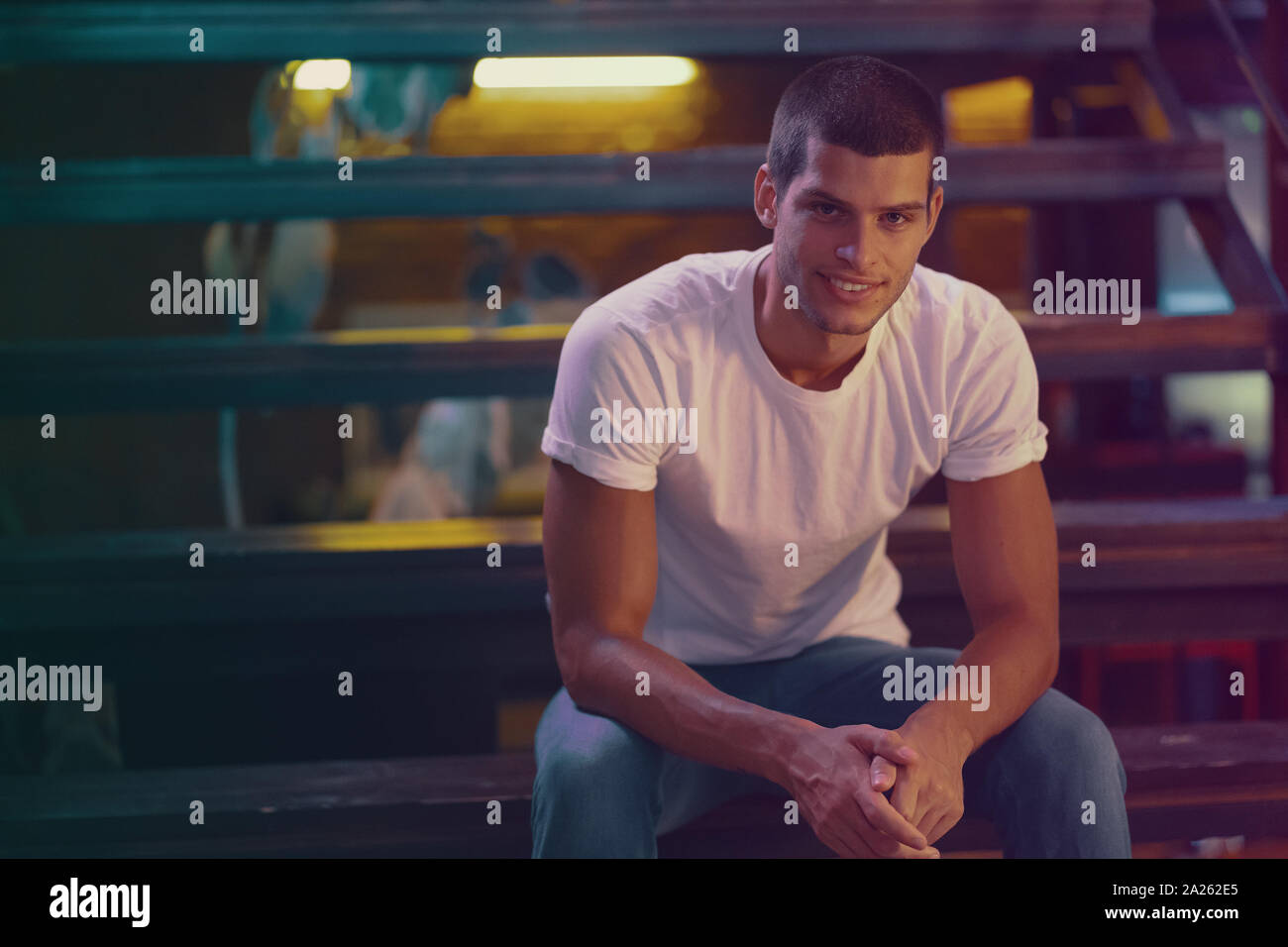 Close-up portrait of attractive male model. Retro wave portrait of a ...