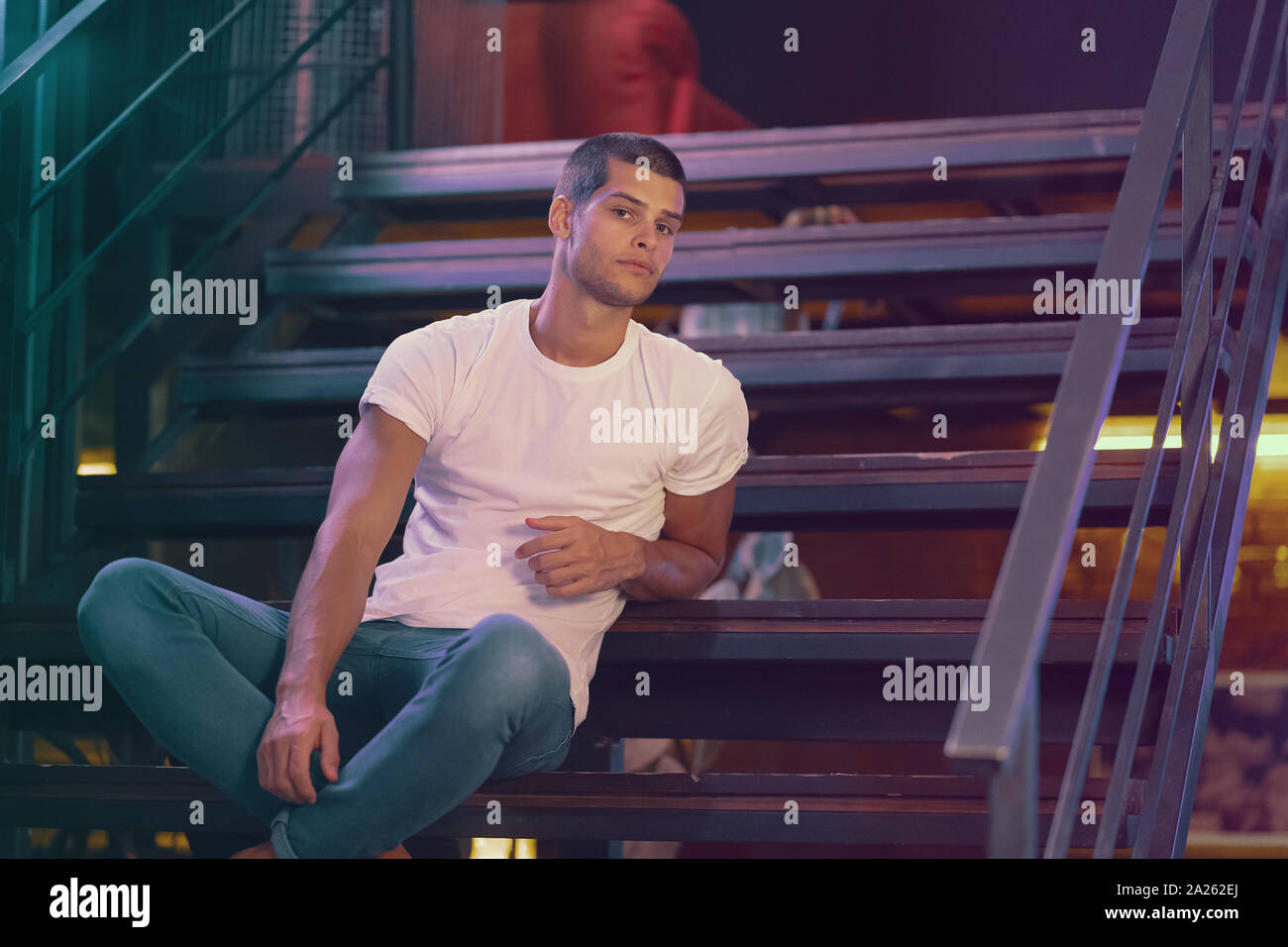 Close-up portrait of attractive male model. Retro wave portrait of a ...