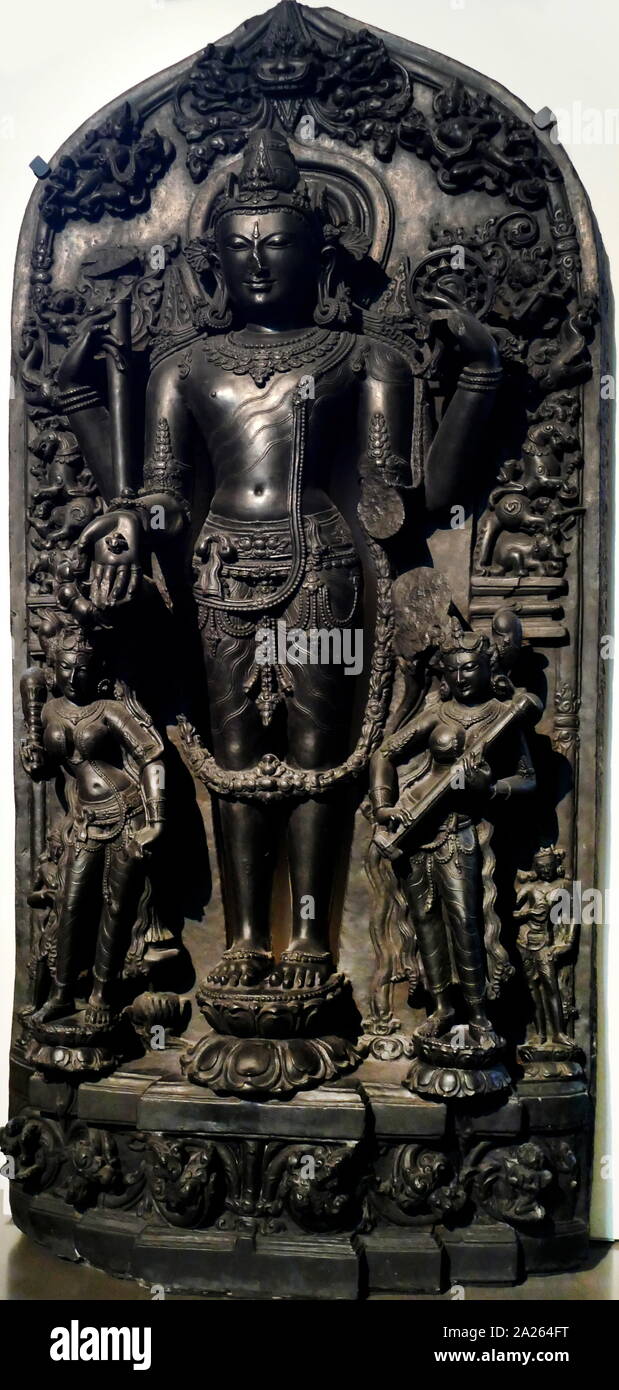 Bronze statue of the Hindu God Vishnu standing on a lotus. 1000 AD ...