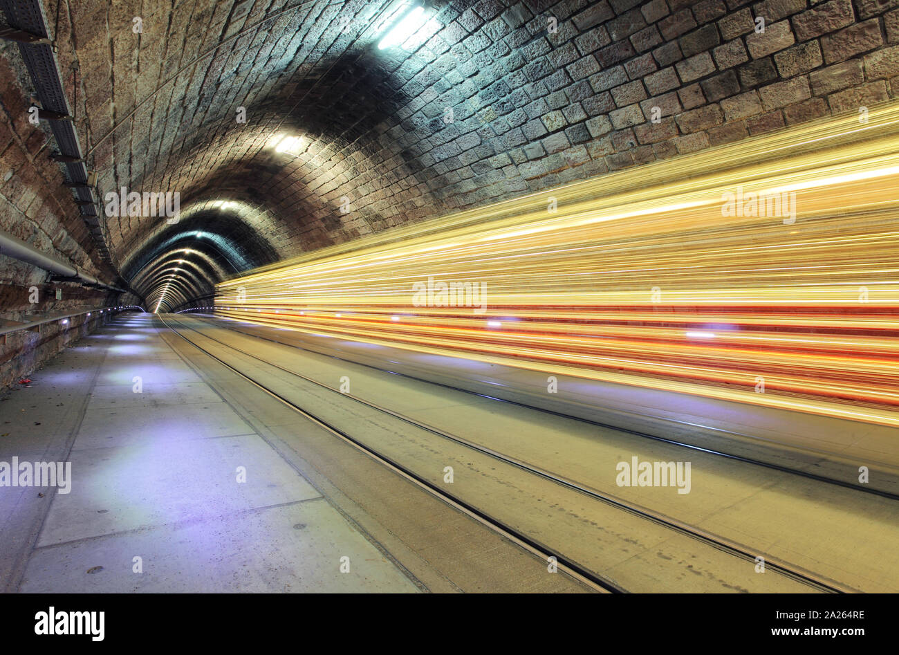 Underground railroad with moving train, transporation Stock Photo - Alamy