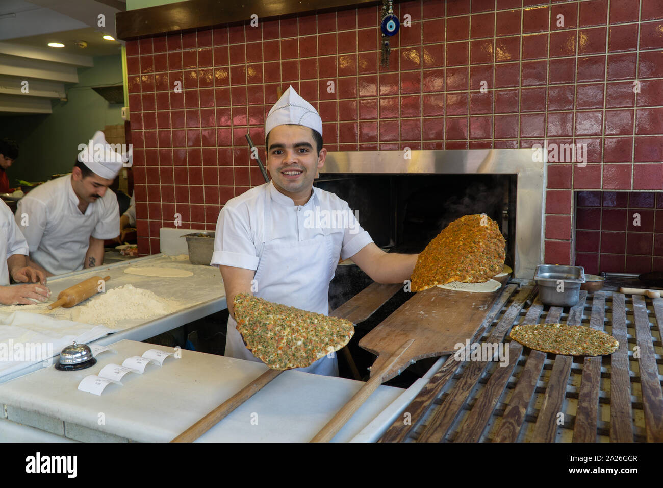 Chef at work, man preparing lahmacun. Traditional Turkish Food aka ...