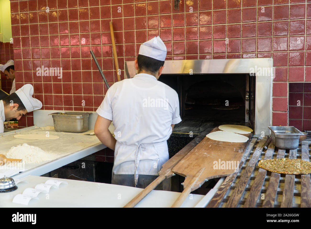 Chef at work, man preparing lahmacun. Traditional Turkish Food aka ...