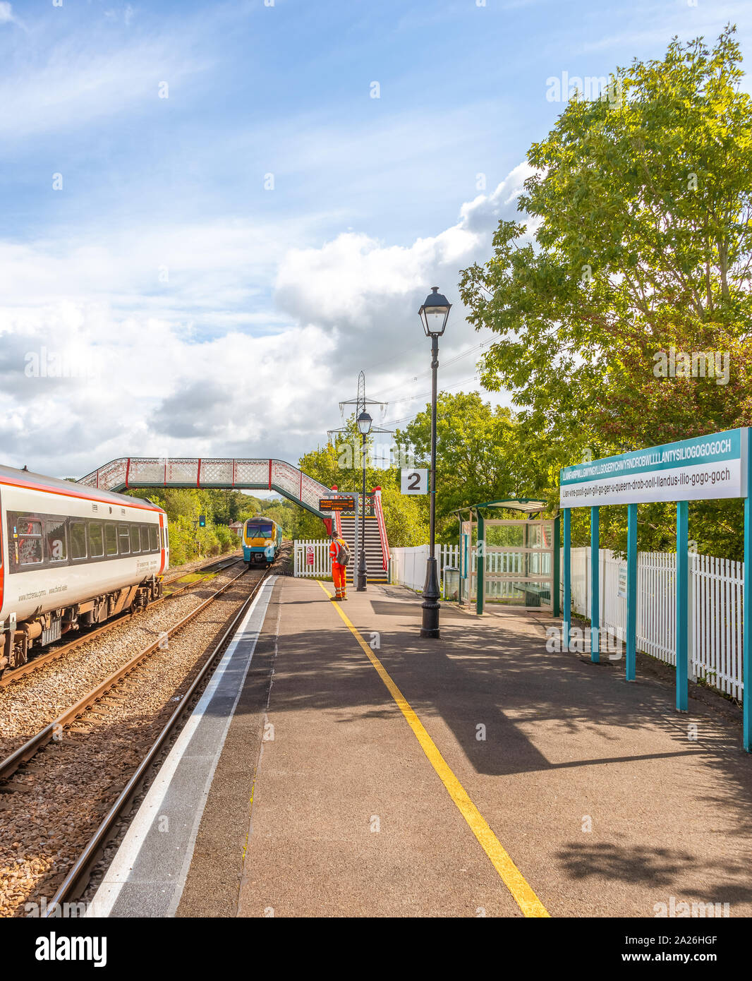 Station platform and sign at Llanfairpwllgwyngyll in North Wales. A ...