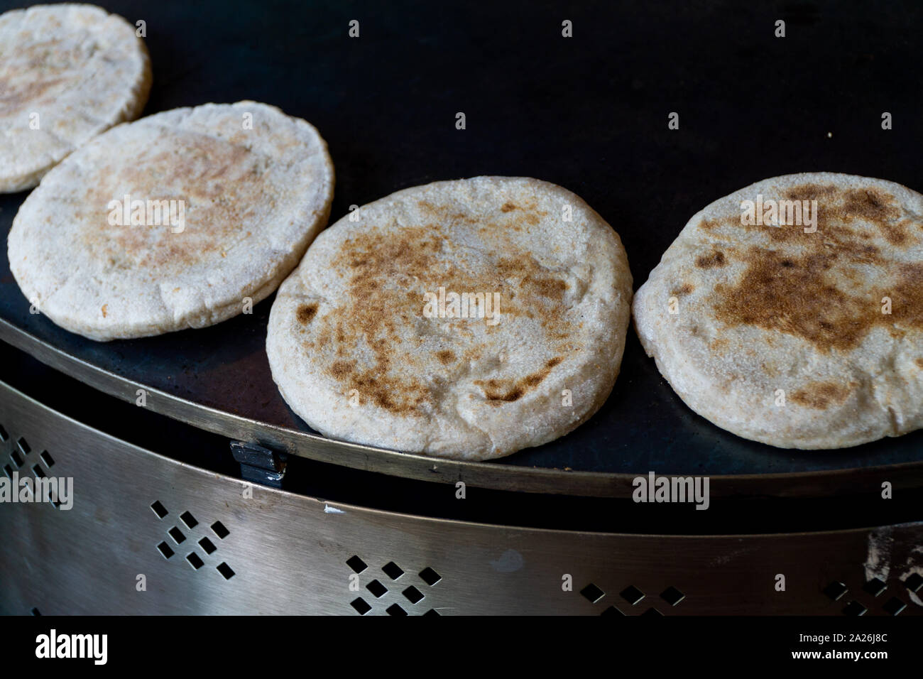 Baking pita bread, small fluffy breads. Also known as pide or bazlama ...