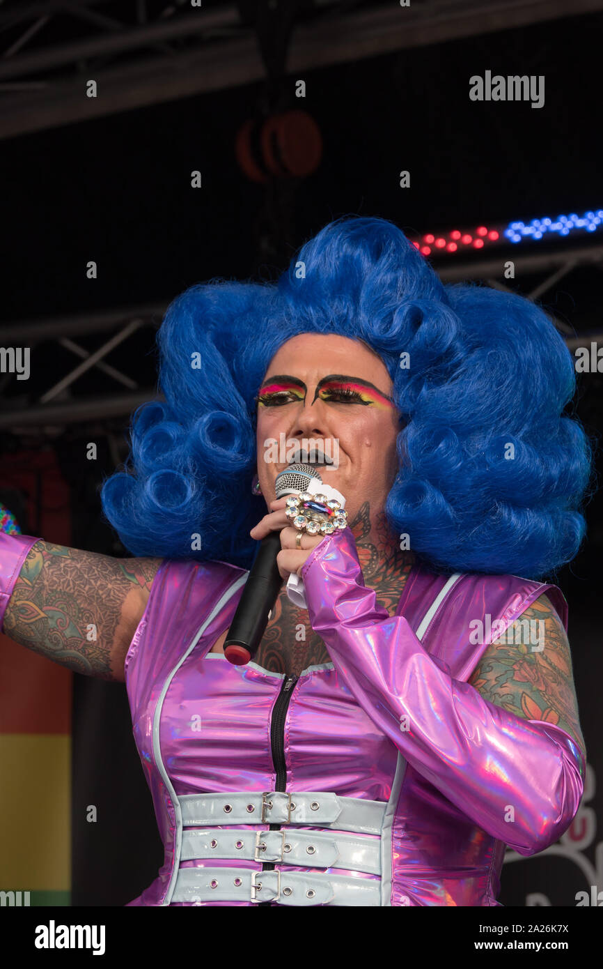 Drag artist stage name "Shagger" with a huge blue wig and eccentric ...