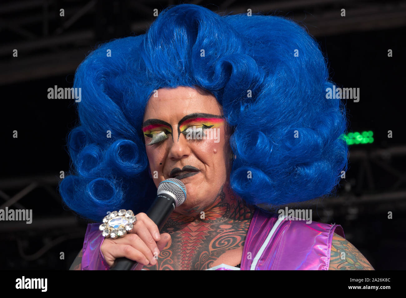 Drag artist stage name "Shagger" with a huge blue wig and eccentric ...