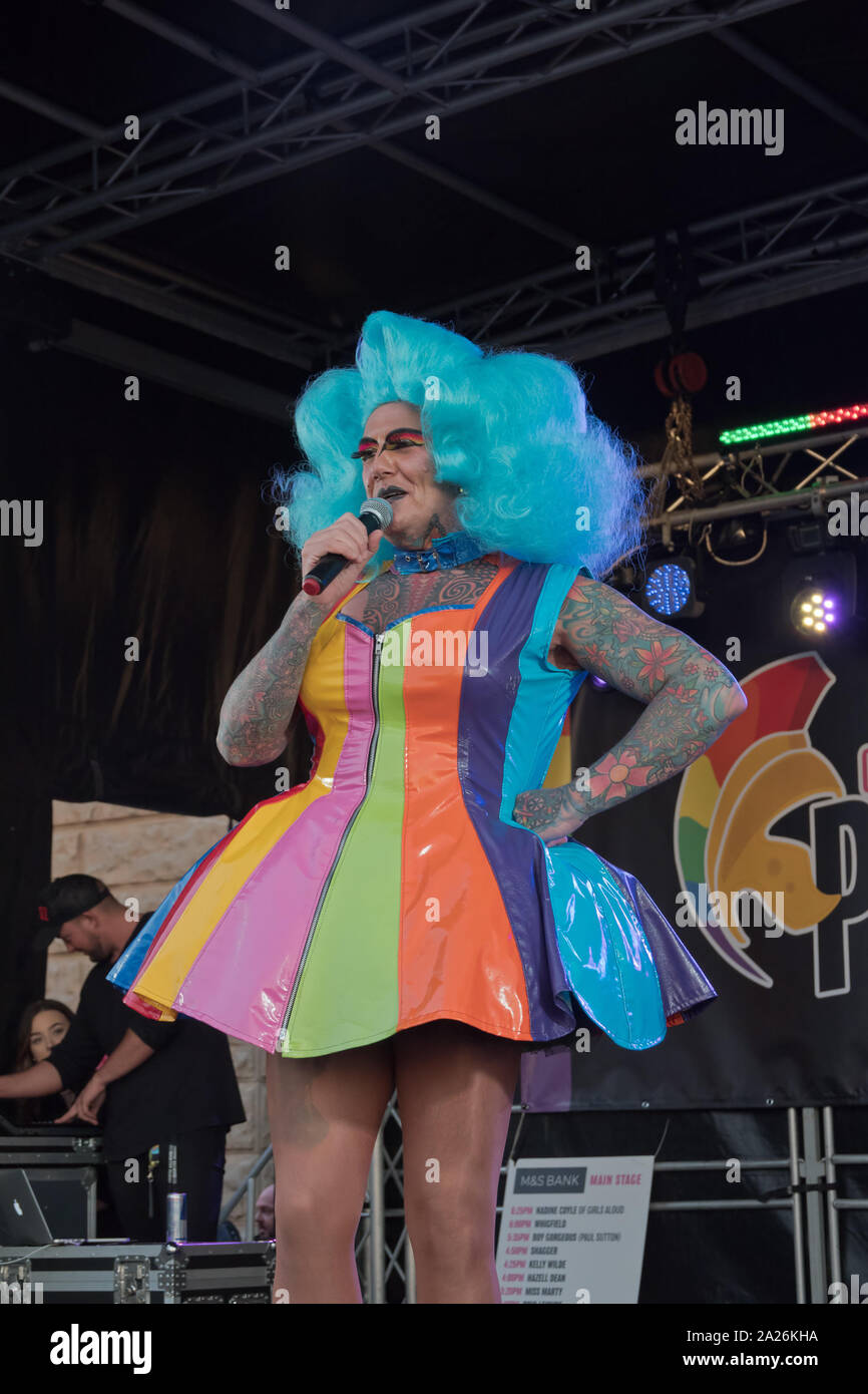 Drag artist stage name "Shagger" with a huge blue wig and eccentric ...