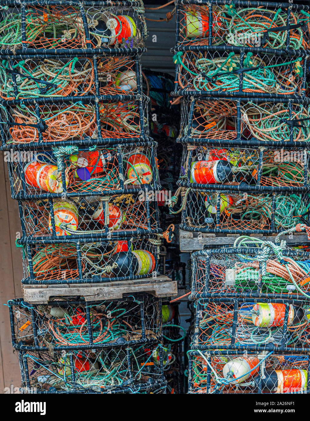 Stacks of baskets containing fishing nets and floasts Stock Photo - Alamy