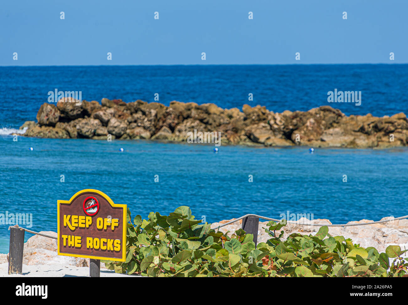 Keep Off the Rocks sign by seawall in Haiti Stock Photo - Alamy