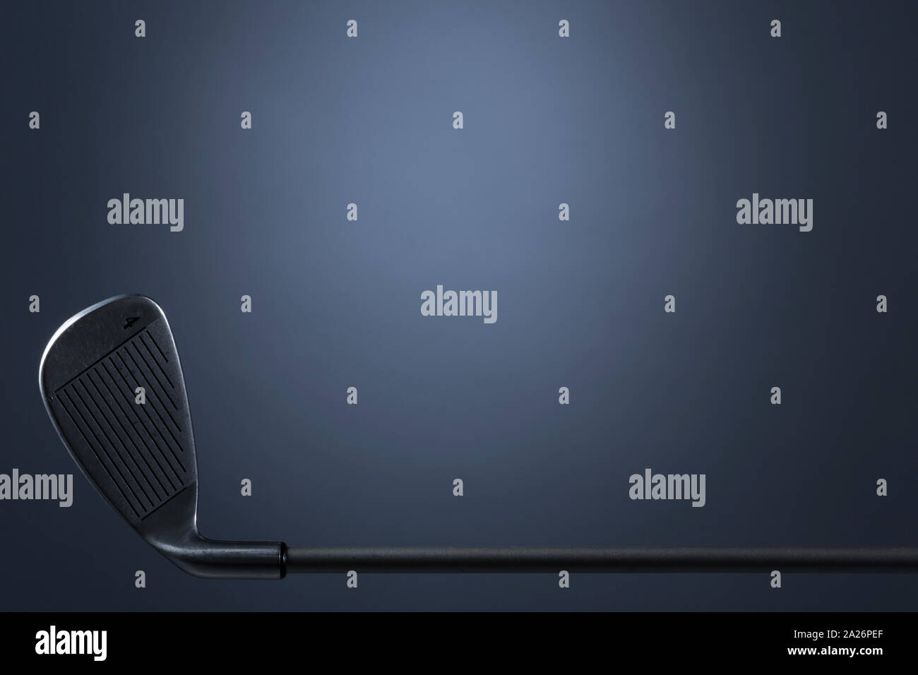 Golf club isolated on dark blue background Stock Photo - Alamy