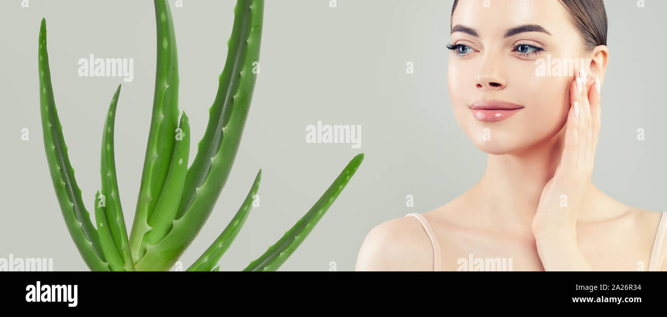 Pretty woman with healthy skin and aloe vera leaves Stock Photo - Alamy