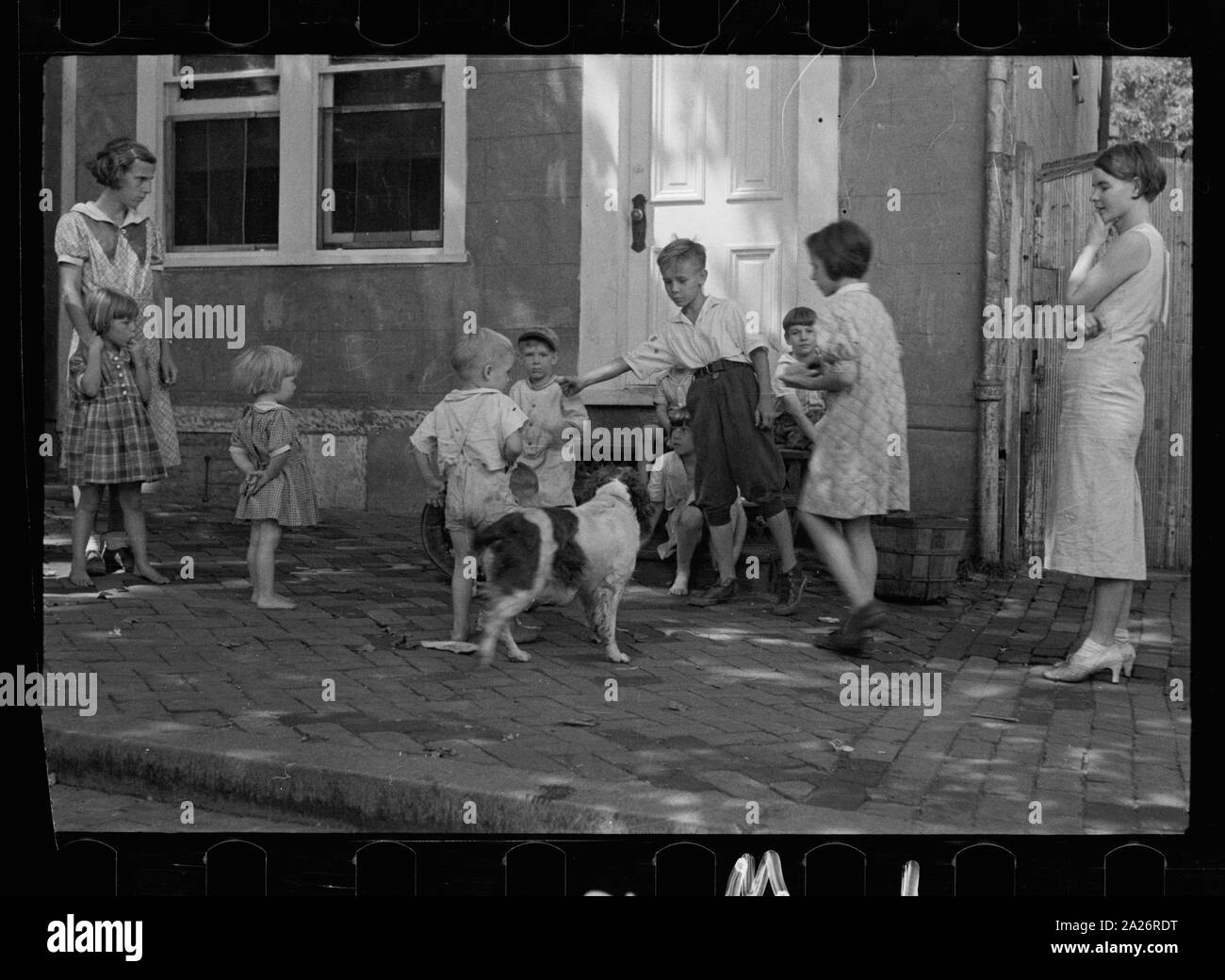Poor children playing on sidewalk, Georgetown, Washington, D.C Stock ...