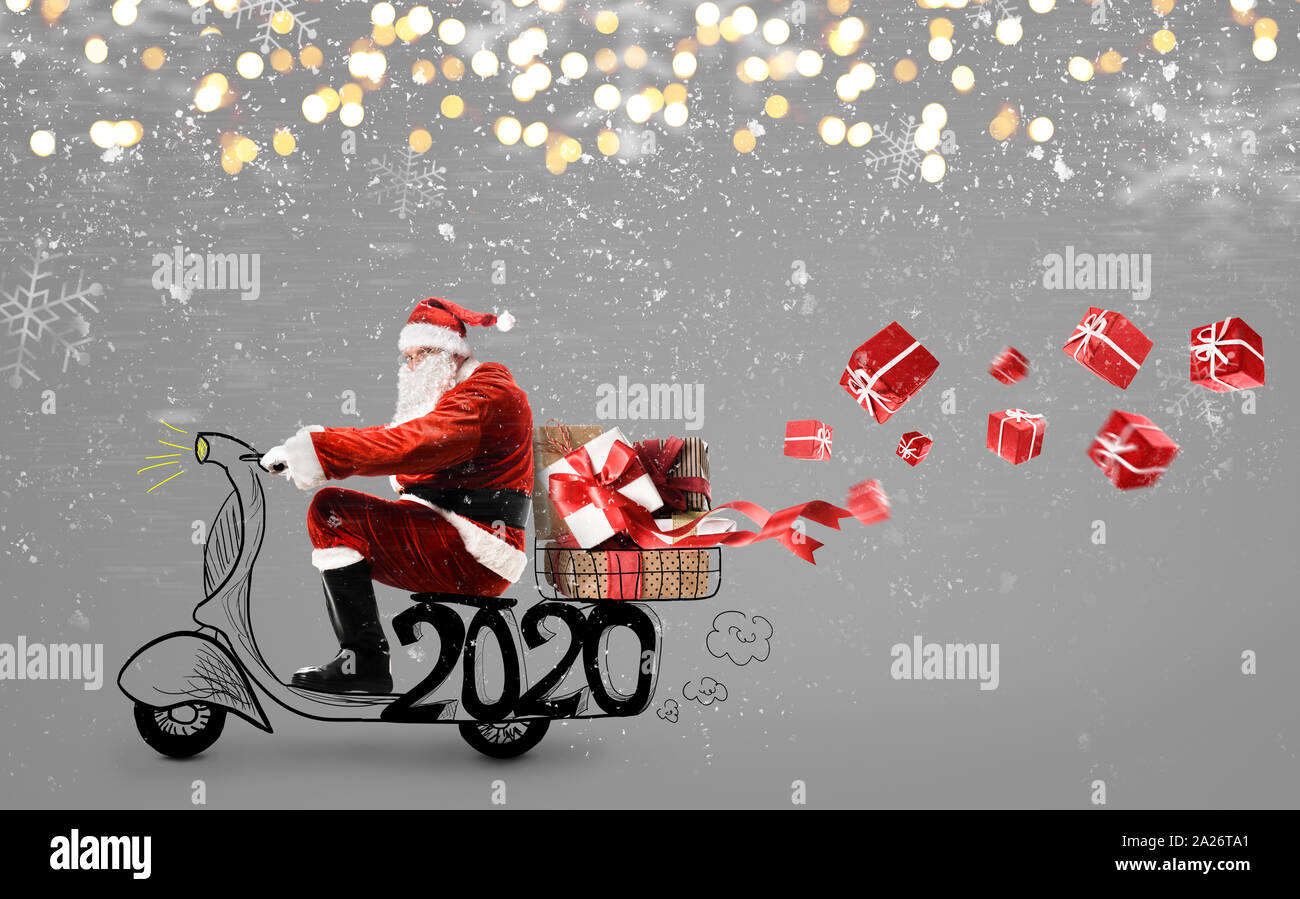 Santa Claus on scooter Stock Photo - Alamy