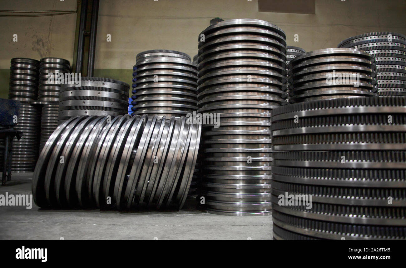 stacked steel pulleys inside factory Stock Photo - Alamy