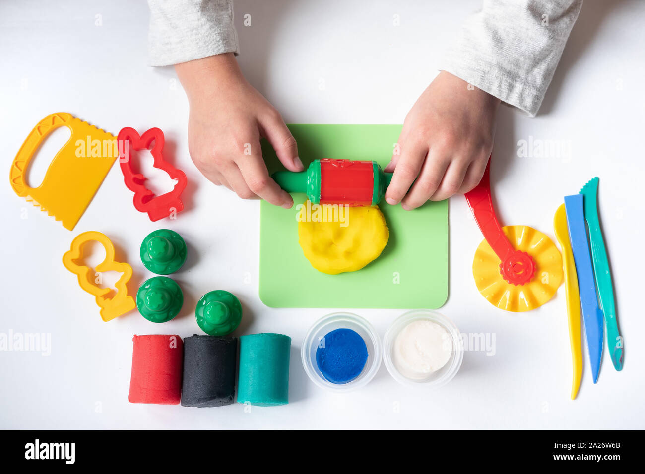 Child's hands sculpting clay figures Stock Photo - Alamy