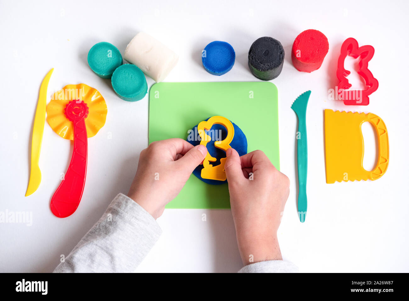 Child's hands sculpting clay figures Stock Photo - Alamy