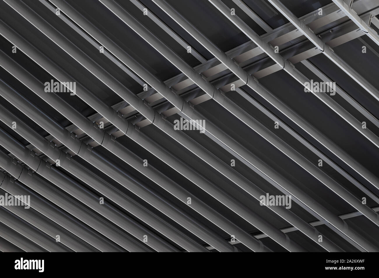 Angular view close-up of dark metal beams structure in ceiling of ...