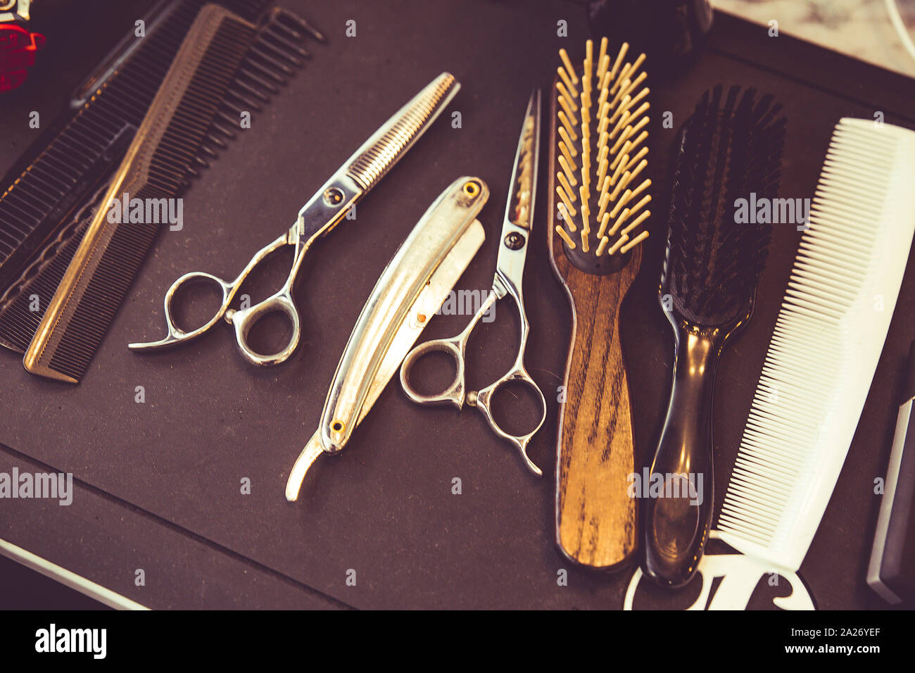 razor scissors and professional work combs used by the barber Stock ...
