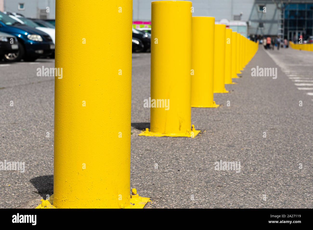 Bright yellow limitation signs on road sidewalk Stock Photo - Alamy