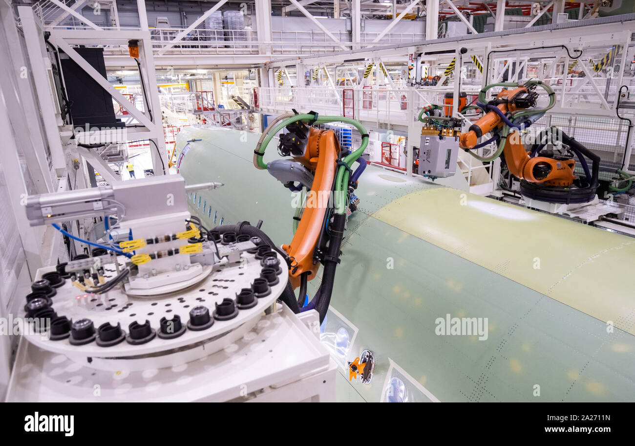 Hamburg, Germany. 01st Oct, 2019. Two robots drilling and setting ...