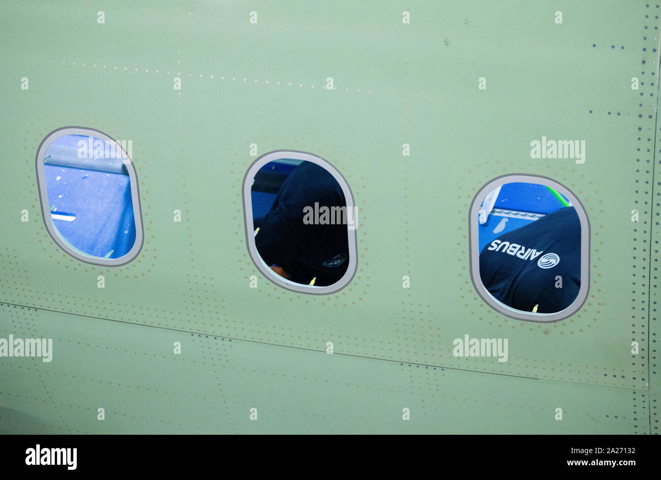 Hamburg, Germany. 01st Oct, 2019. Through an aircraft window, an Airbus ...