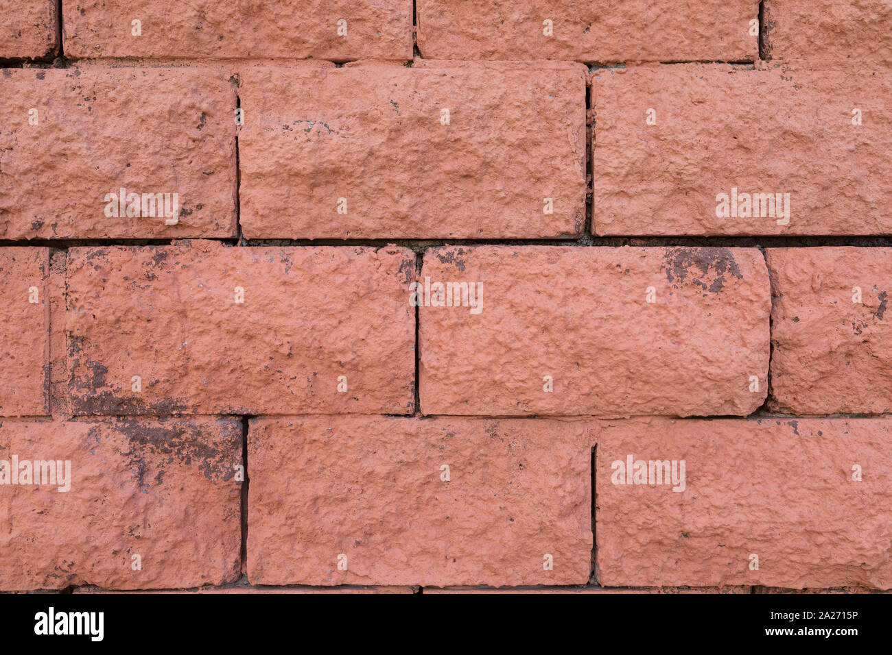 Red decorative tile wall of a building Stock Photo - Alamy