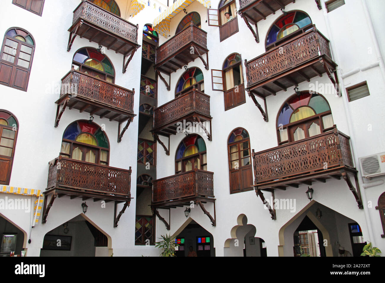 Apartment building balconies with stained glass, Stone Town, Zanzibar ...