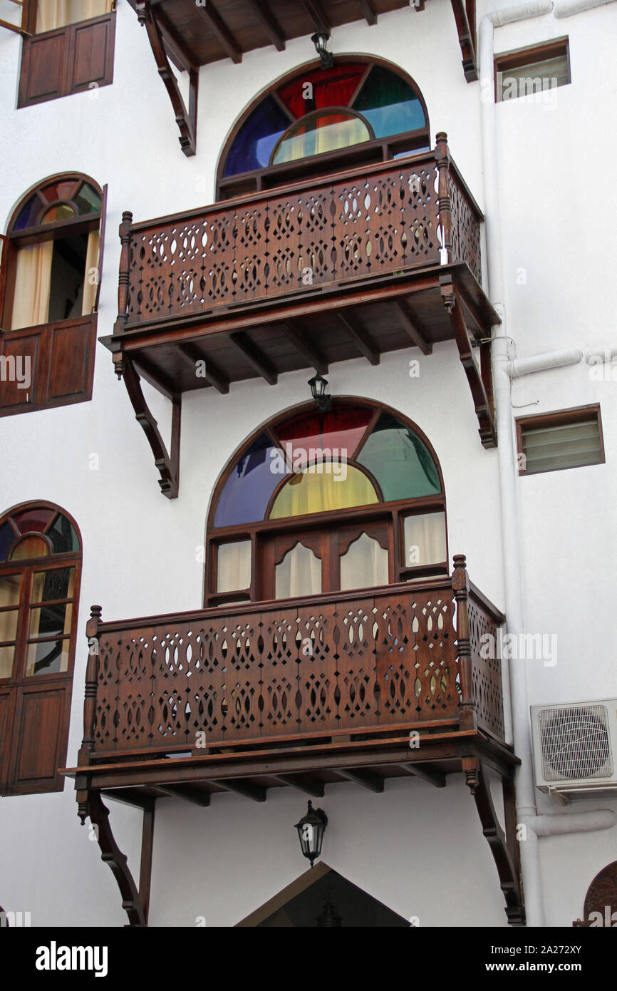 Apartment building balconies with stained glass, Stone Town, Zanzibar ...