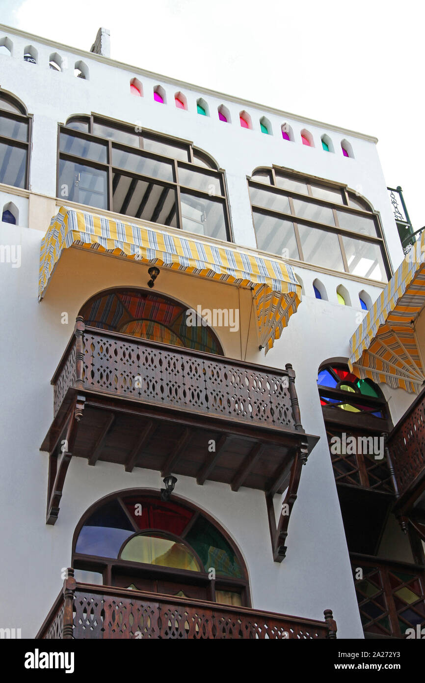 Apartment building balconies with stained glass, Stone Town, Zanzibar ...