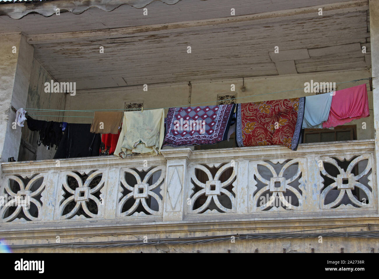 Washing line on balcony of apartment in Stone Town, Zanzibar, Unguja ...