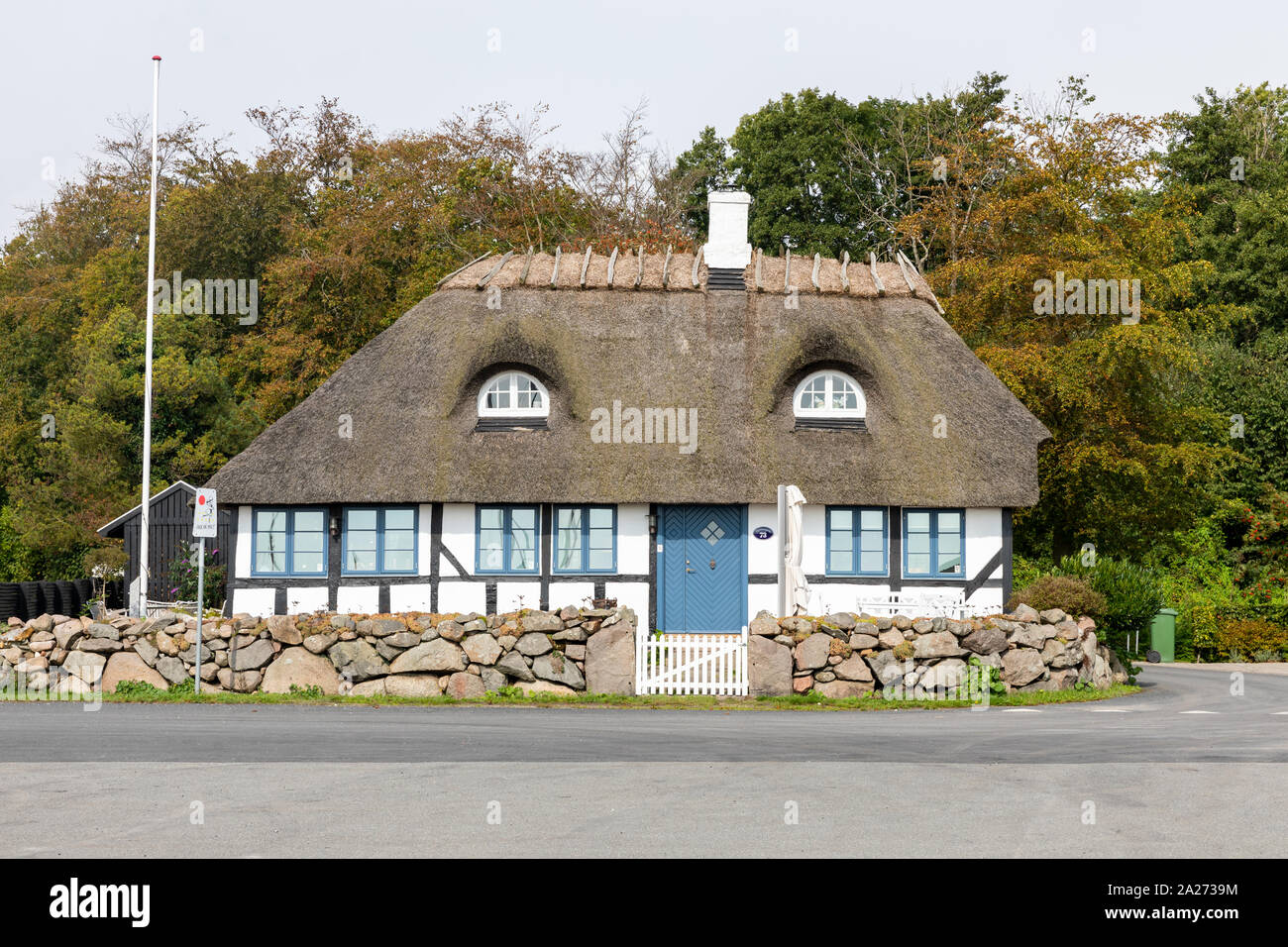 Timber-framed house with thatched roof in Dyreborg on Funen, Denmark ...