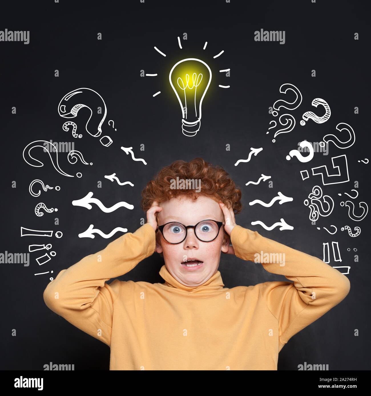 Shocked boy student with lightbulb on black background Stock Photo - Alamy