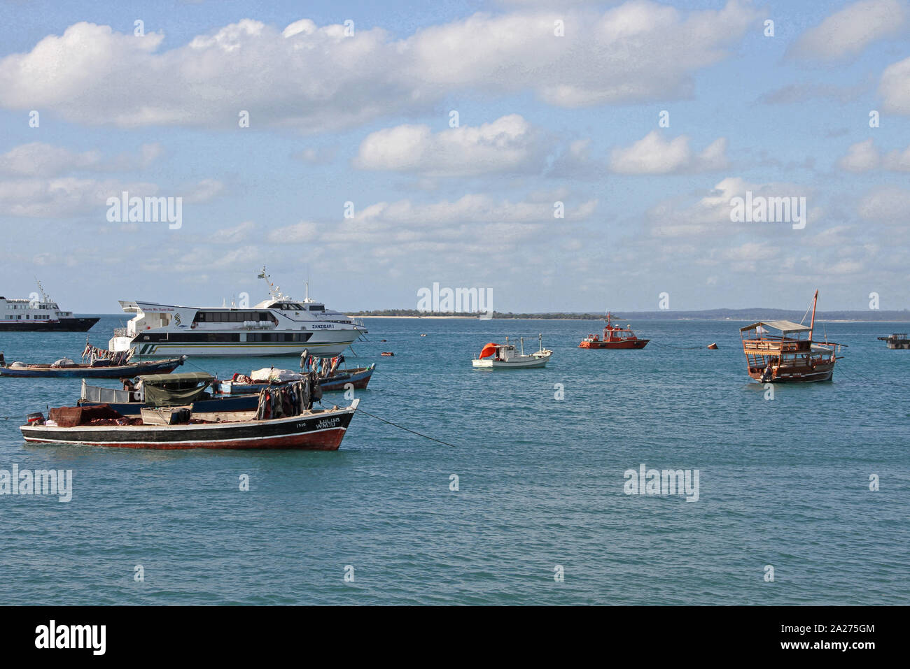 Boats in the sea off Stone Town, Zanzibar, Unguja Island, Tanzania ...