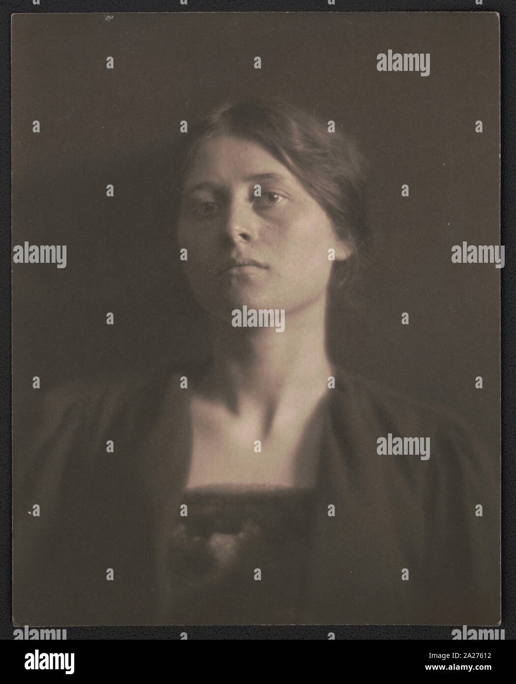 Portrait of an unidentified woman, facing front, wearing dark clothing ...