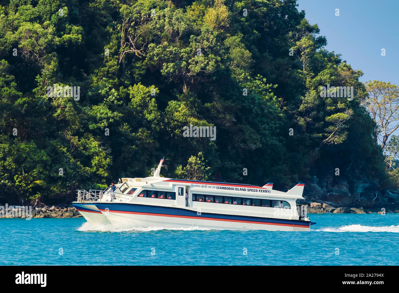High speed tourist ferry arriving at this holiday island; Saracen Bay ...