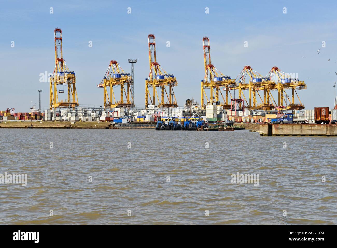 Yellow loading bridges and cranes on Bremerhaven's big container ...