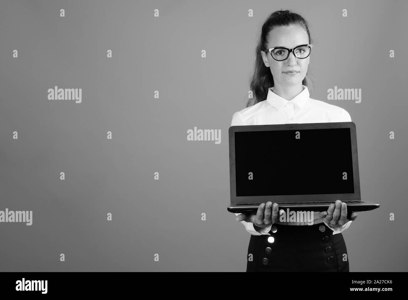 Holding laptop Black and White Stock Photos & Images - Alamy