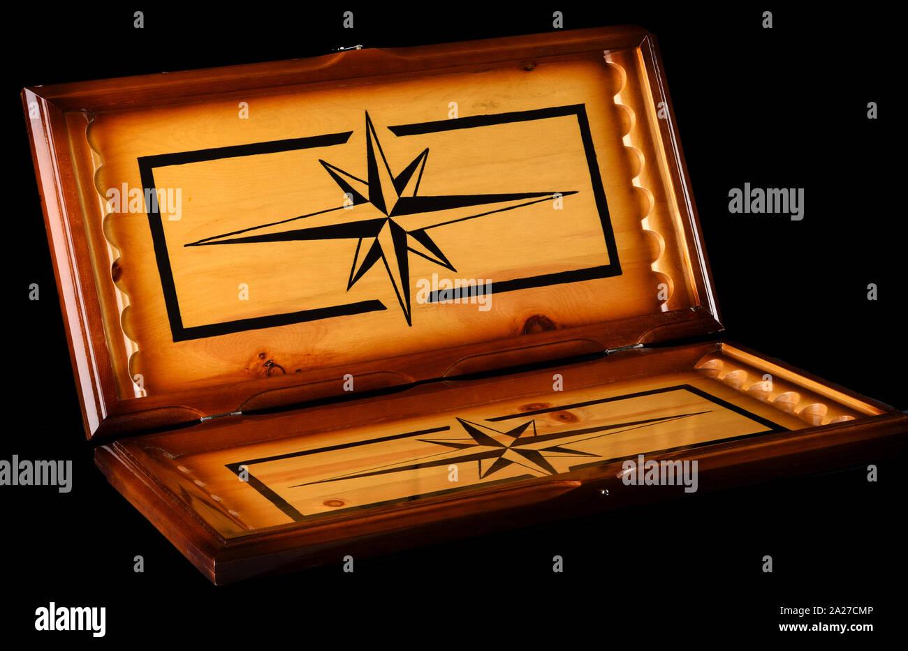 Opened backgammon board over a dark background. A beautiful board for ...