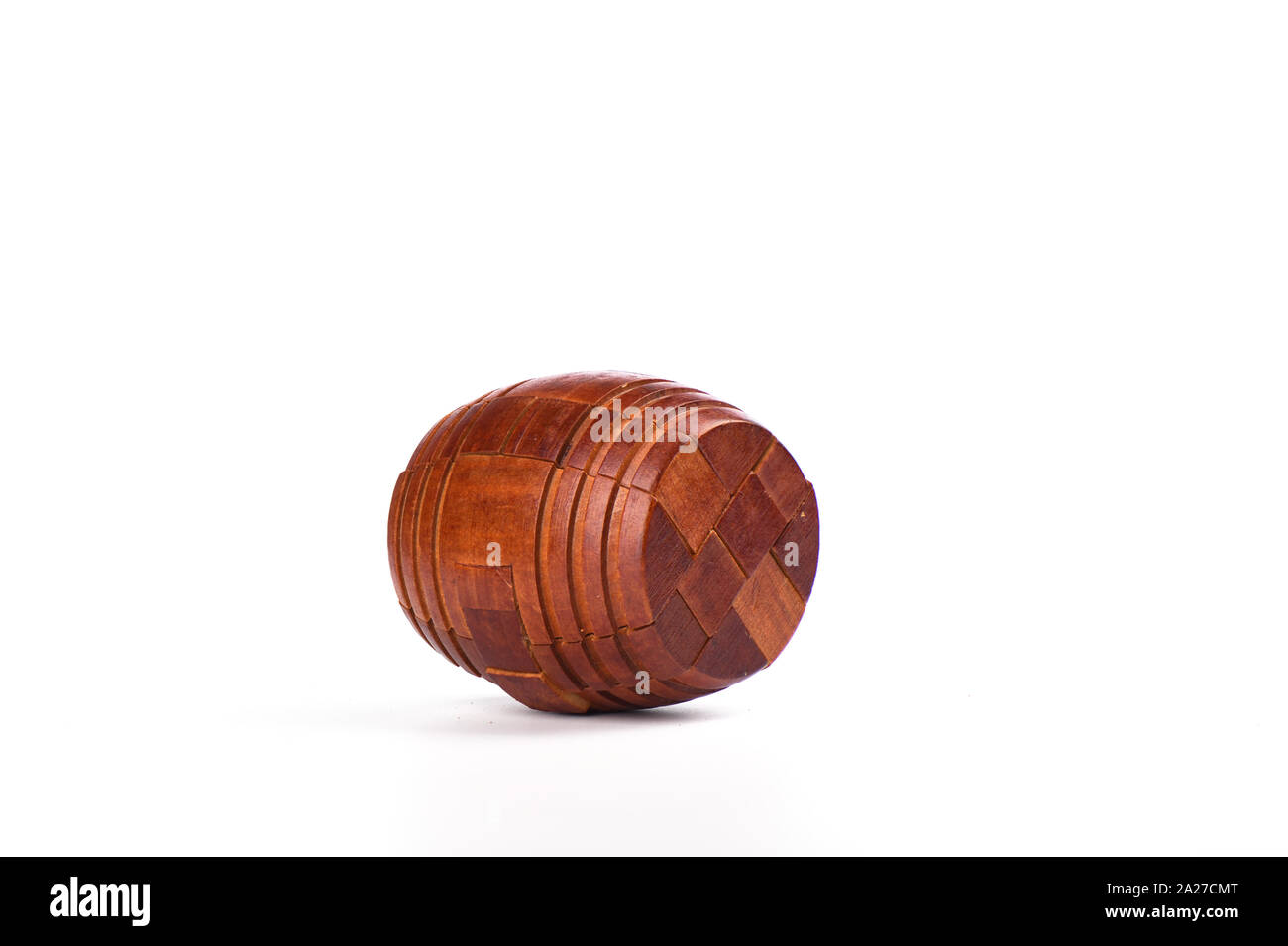 Assembled wooden puzzle barrel isolated on a white background. Barrel ...