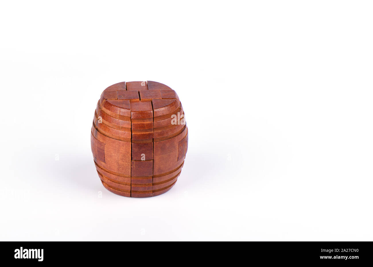 Assembled wooden puzzle barrel isolated on a white background. Barrel ...