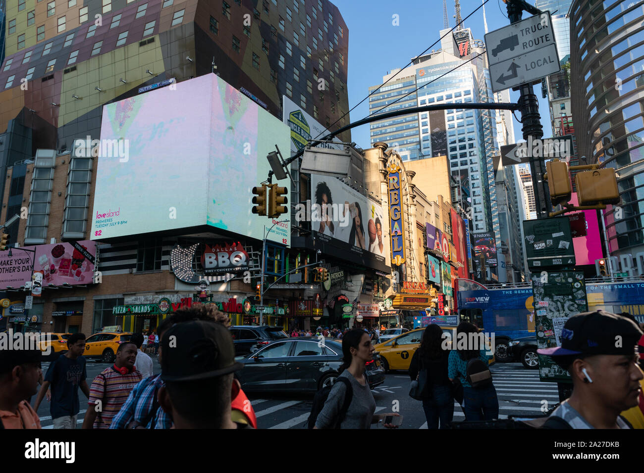 People pass through Midtown Manhattan during rush hour on July 27, 2019 ...