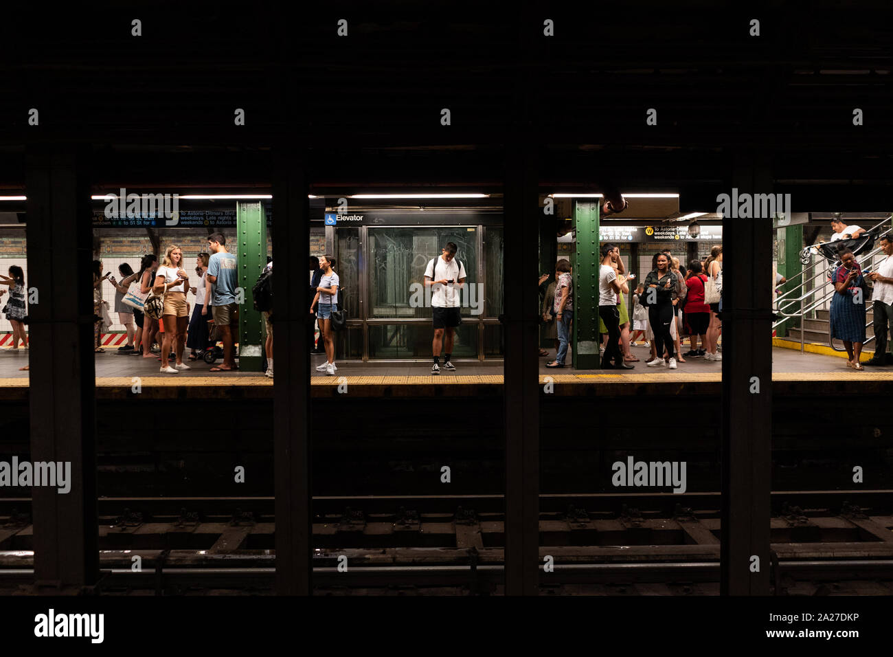 People wait for trains at the MTA Union Square station in New York City ...