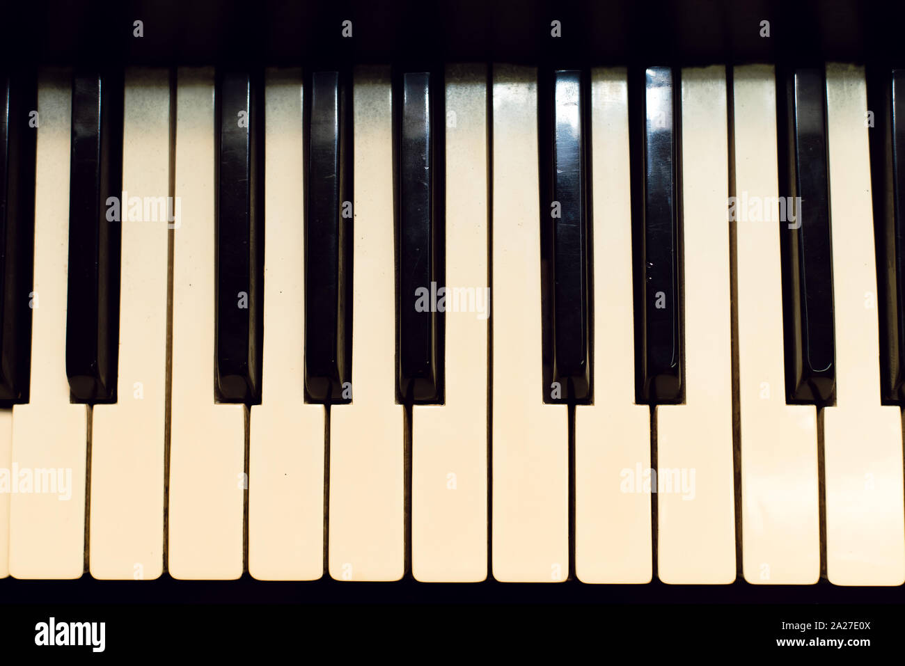 The keys of a classic ivory piano. View from above Stock Photo - Alamy