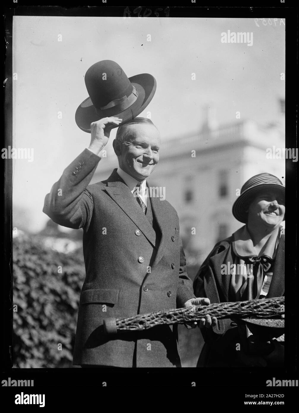 Pres. Coolidge with a hat of the Smoki tribesmen of Prescott, Ariz ...